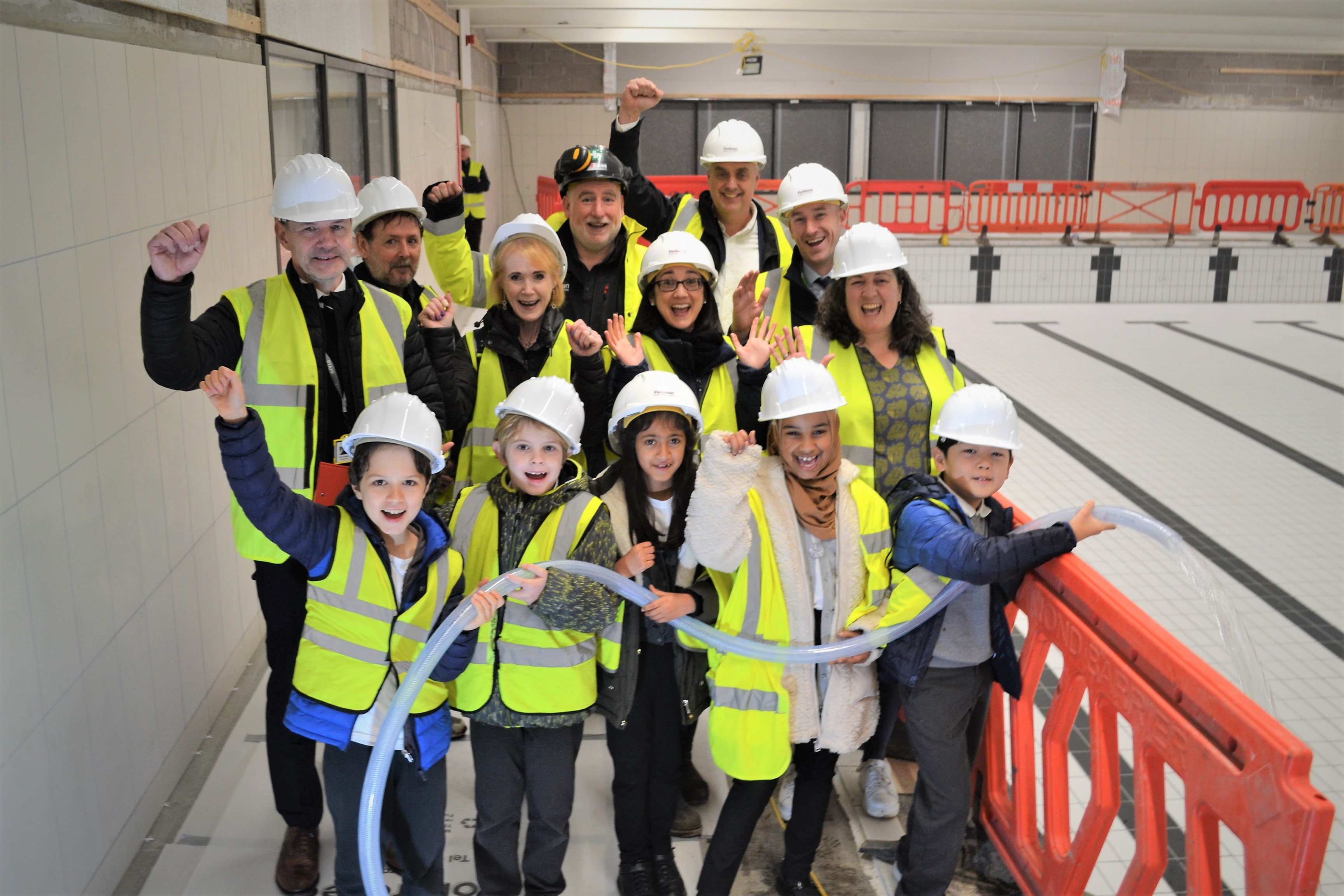 Reading school children help fill the new Palmer Park community pool ...
